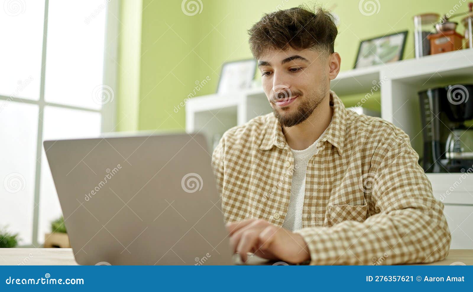 Young Arab Man Using Laptop Sitting on Table at Home Stock Image ...