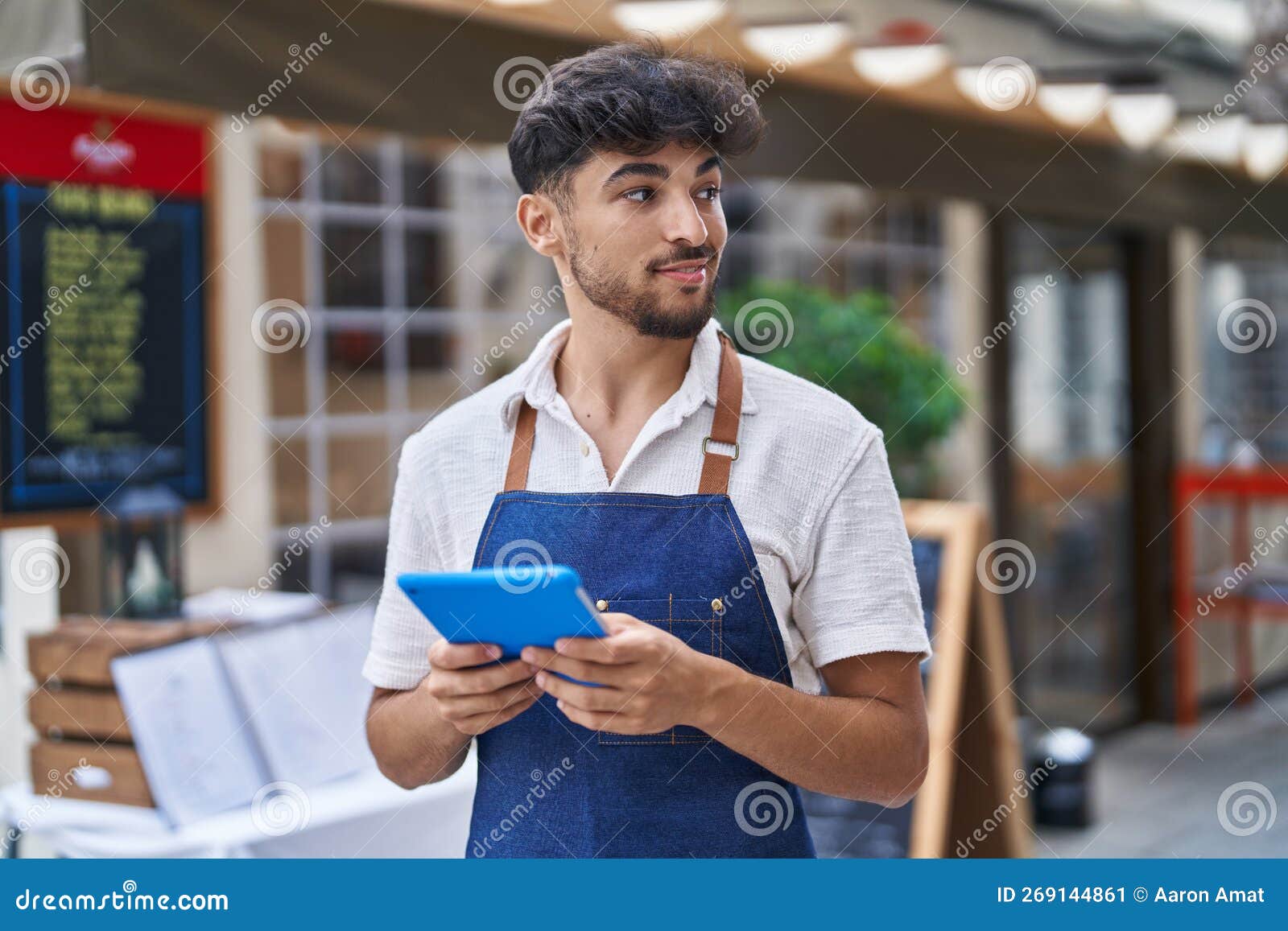 Young Arab Man Waiter Using Touchpad Working at Restaurant Stock Image ...