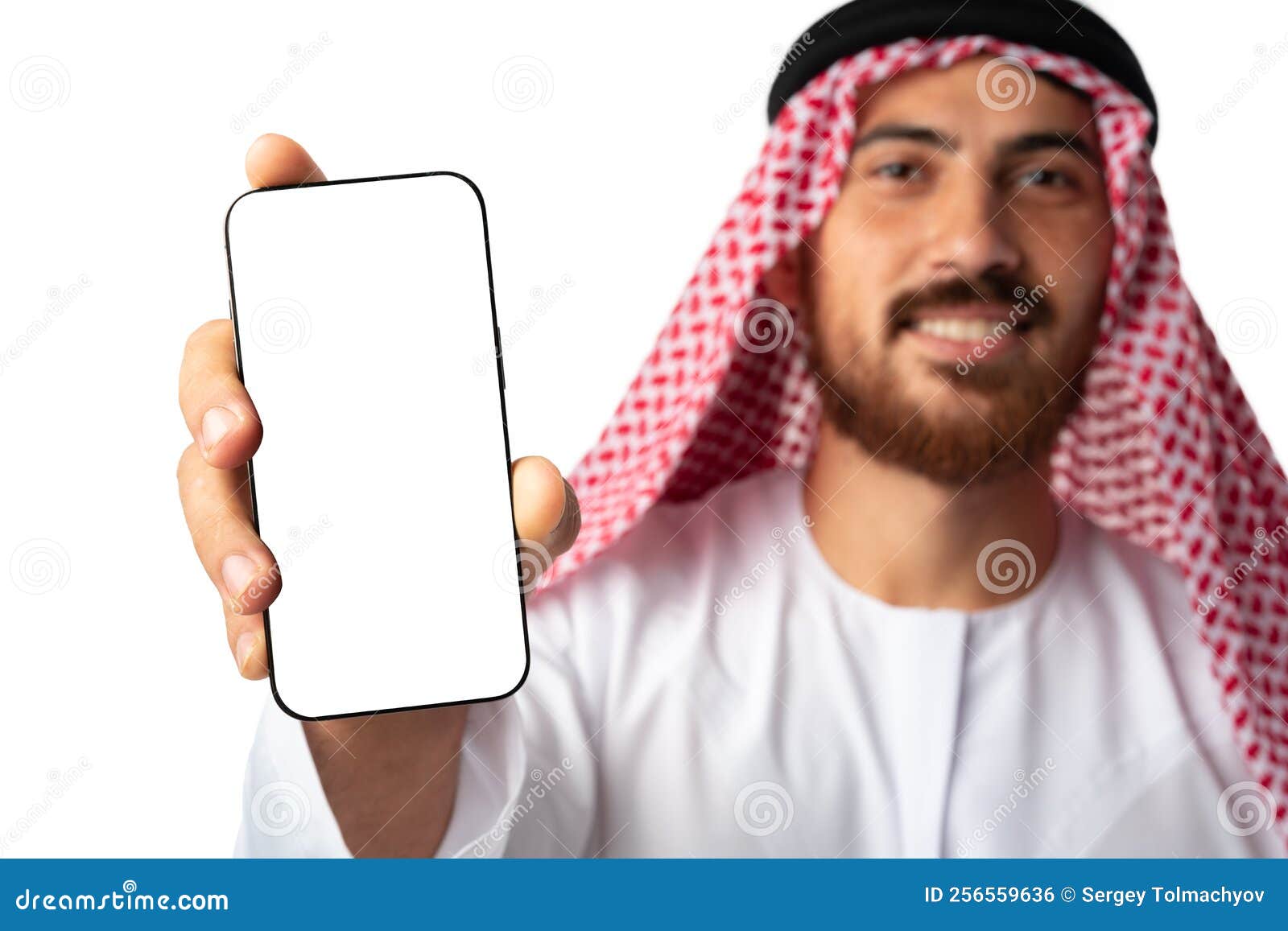 Young Arab Muslim Man in Traditional Clothes Showing Mobile Phone ... Young Arab Muslim Man in Traditional Clothes Showing Mobile Phone ...