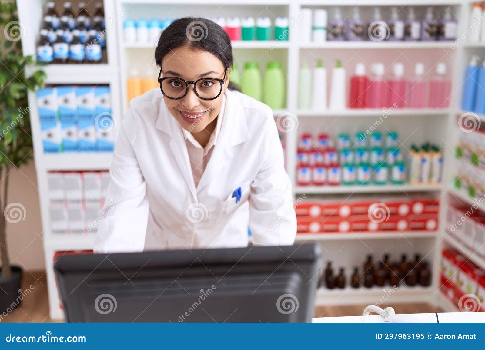 Young Arab Woman Pharmacist Smiling Confident Using Computer at Pharmacy Stock Image - Image of ...