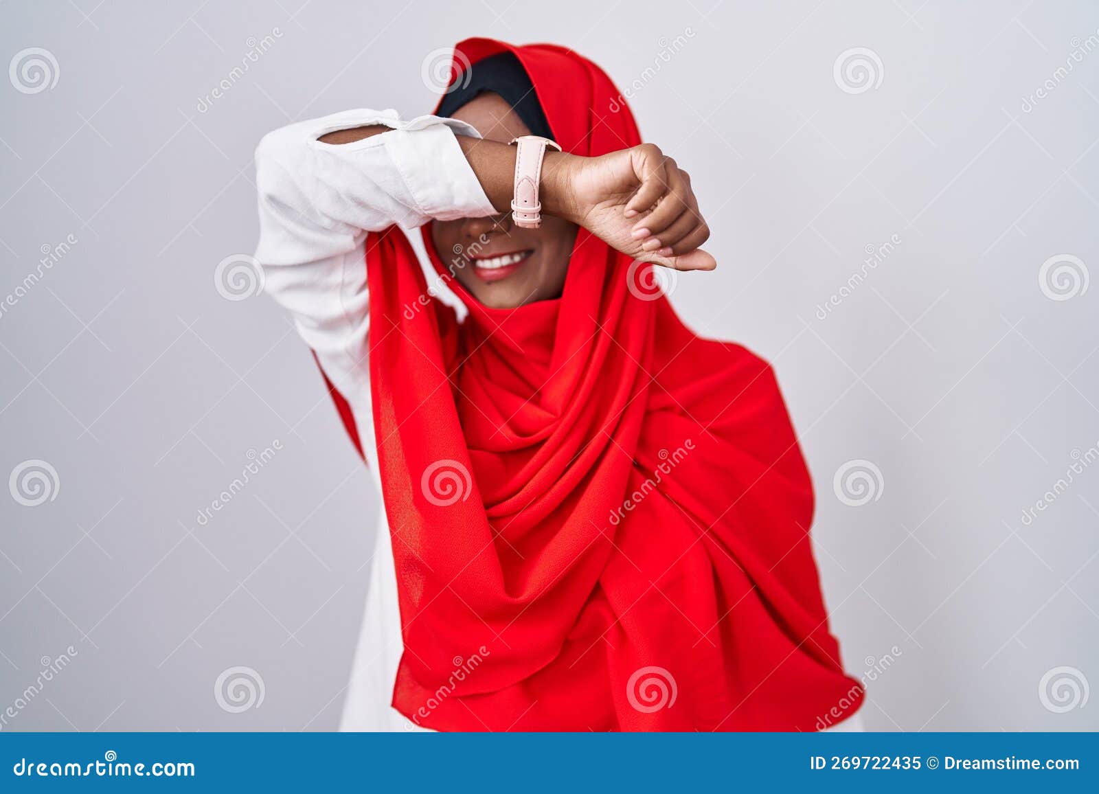 Young Arab Woman Wearing Traditional Islamic Hijab Scarf Covering Eyes