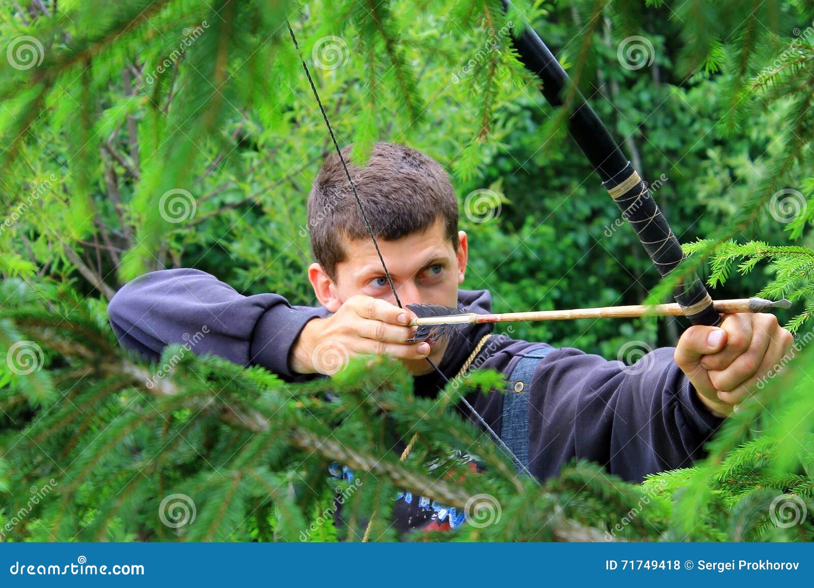 Young archer in forest stock photo. Image of forest, shooting - 71749418