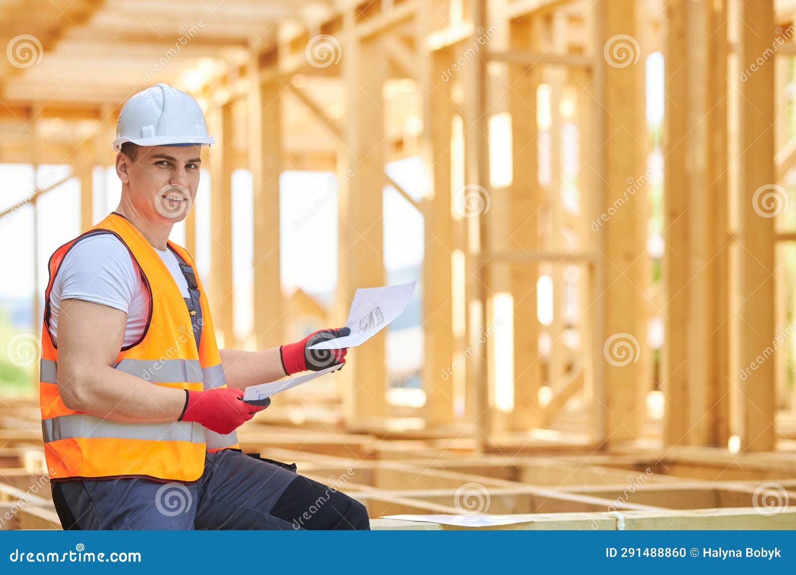 Young Architect, Builder, Engineer Constructing Wooden House in Forest ...