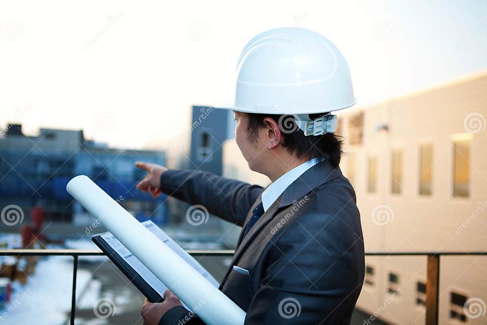 Young Architect Pointing at the Building Construction Stock Image ...