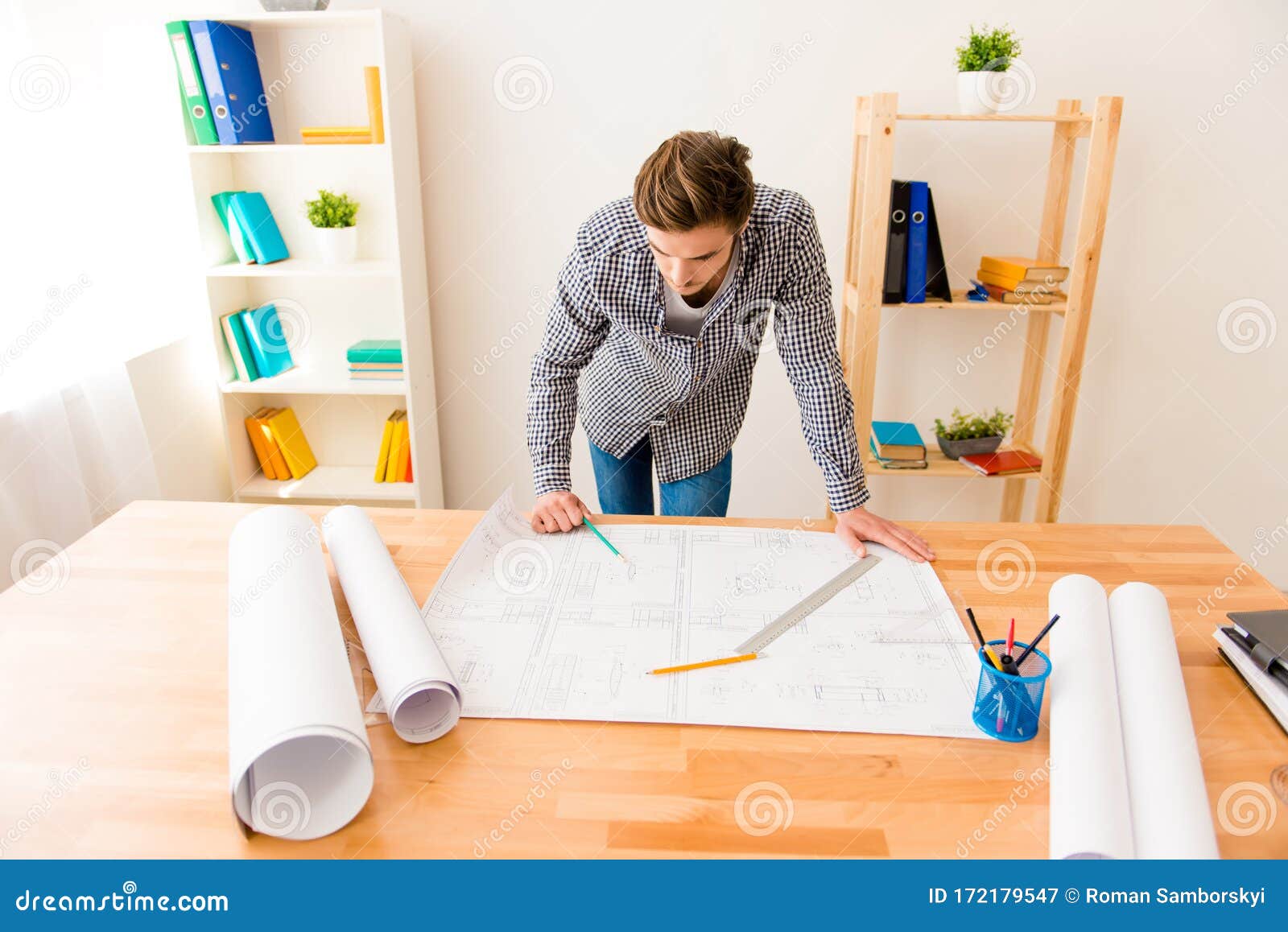 Young Architect Sketching a Construction Project on His Plane Stock ...