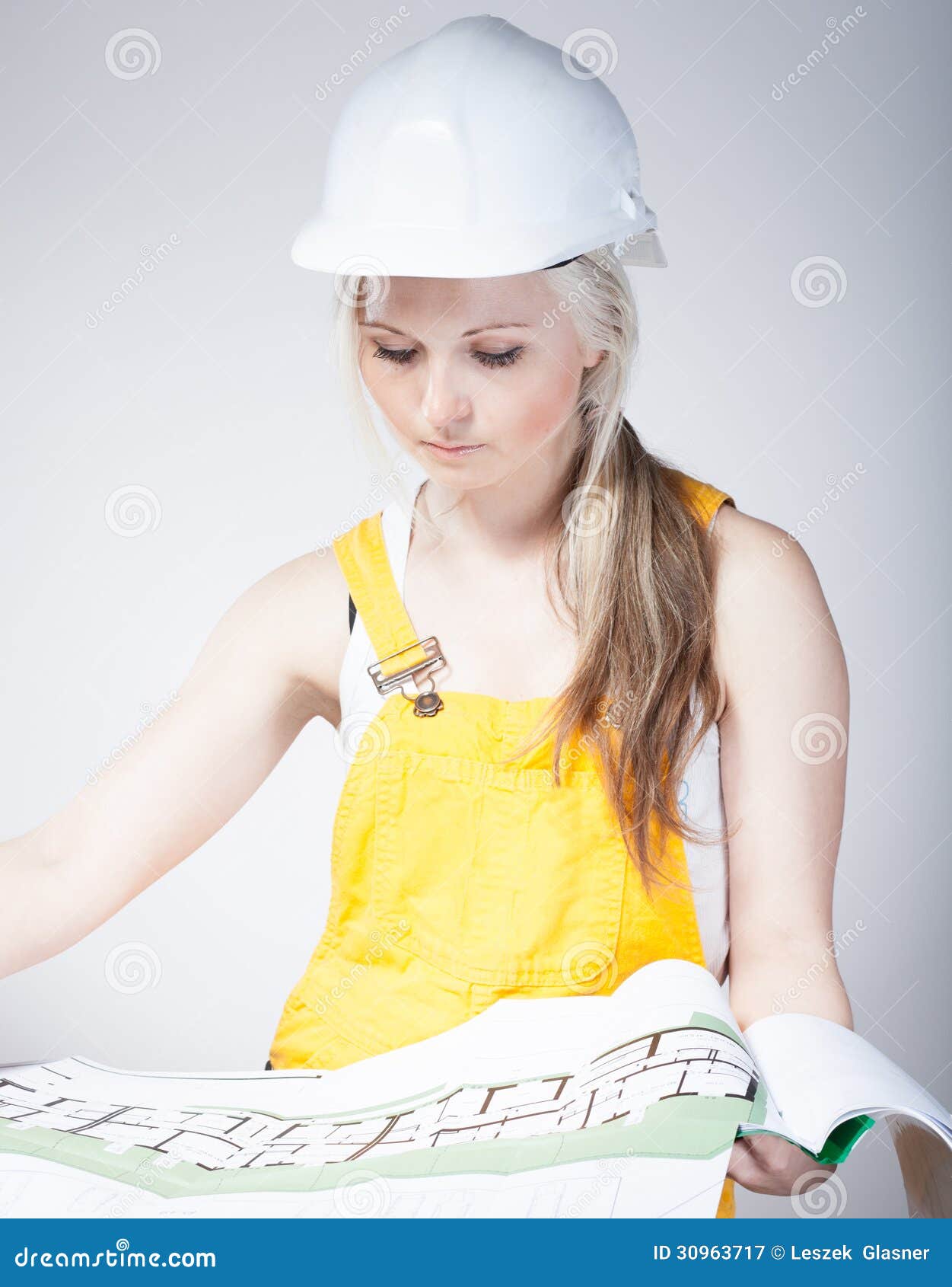Young Architect Woman Construction Worker Reading Blueprints Stock ...