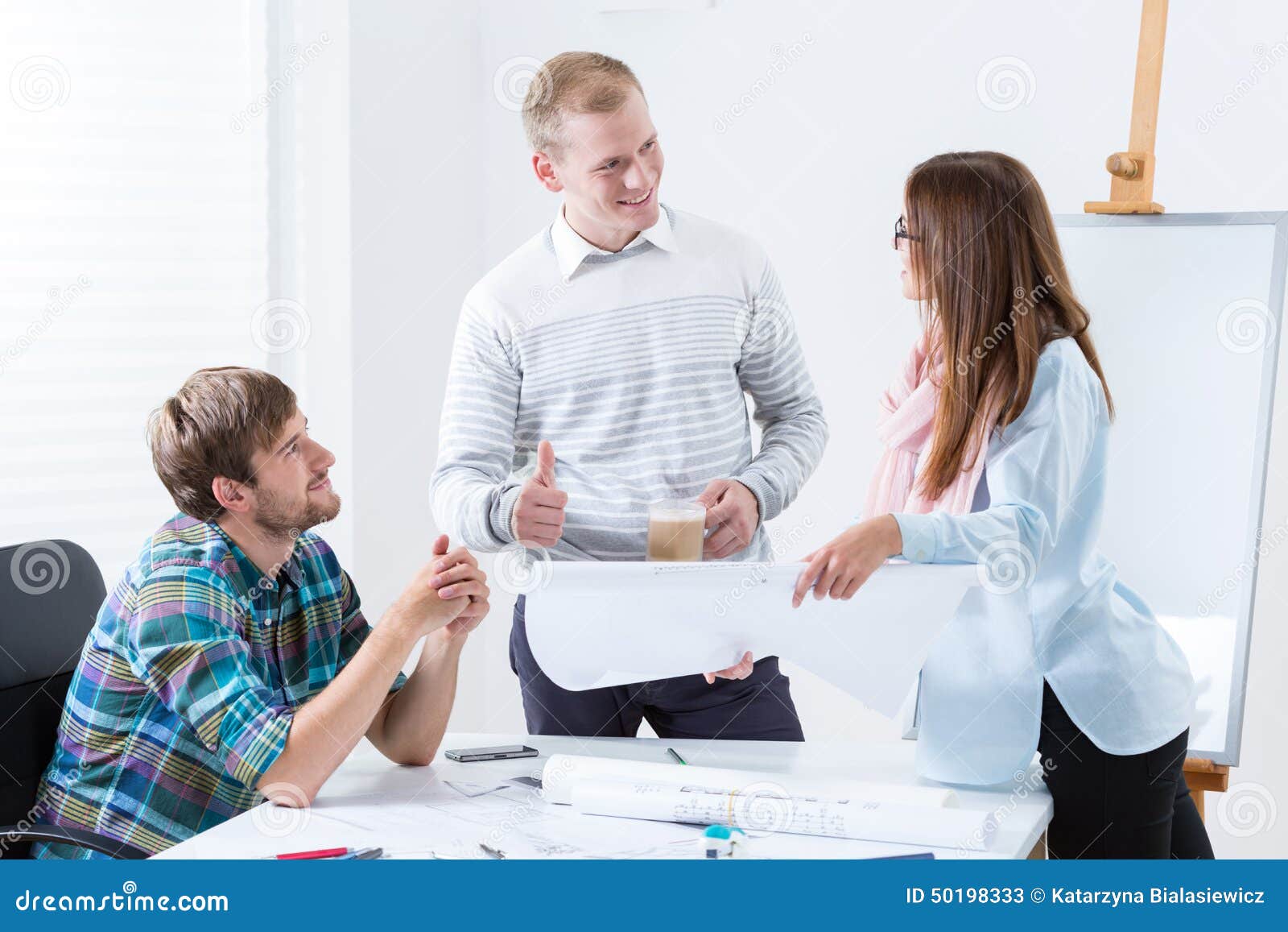 Young Architectural Team at Work Stock Image - Image of drafting, desk ...