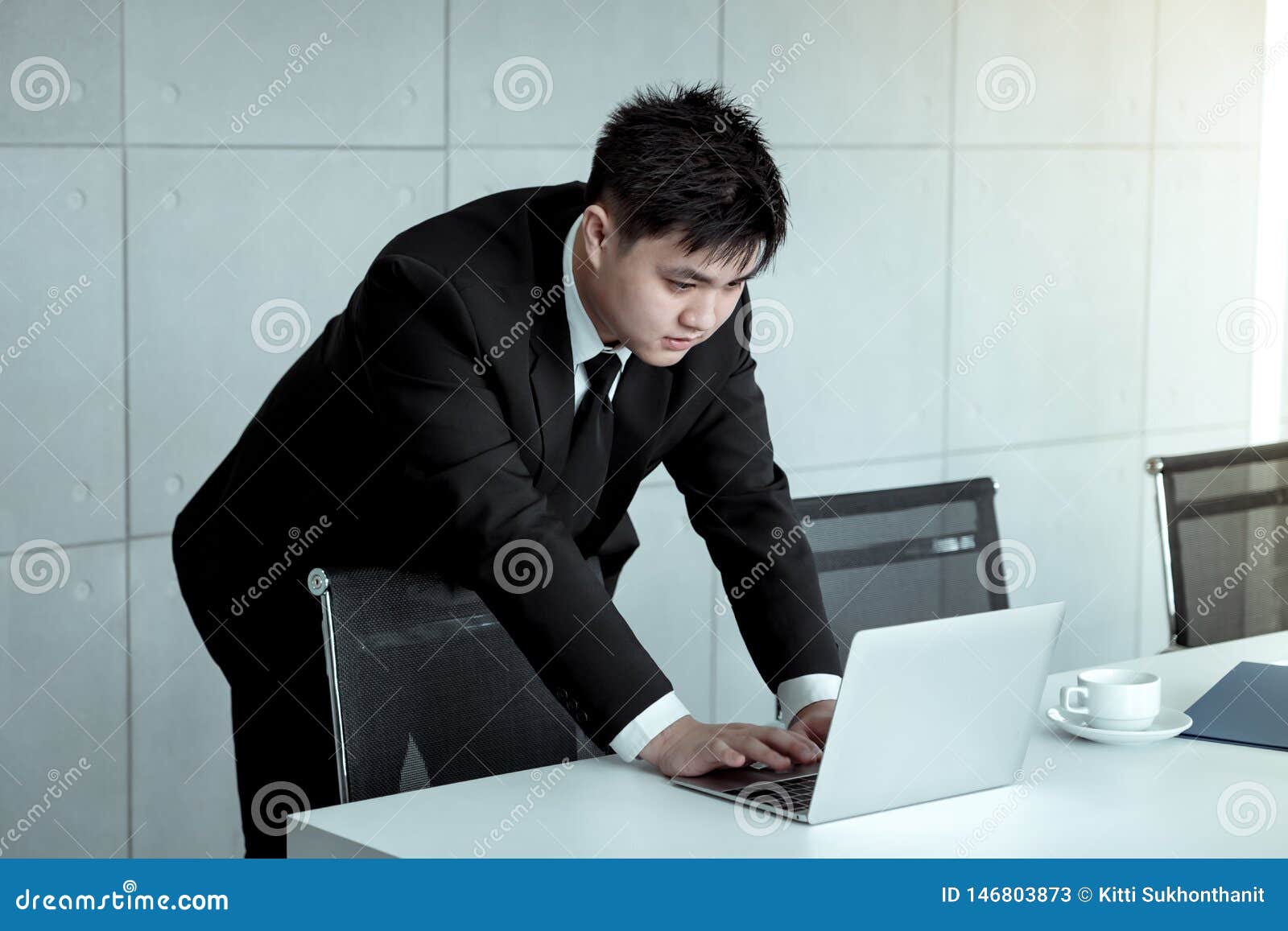 Young Asia Businessman Focused on Solving Difficult Work while Working ...