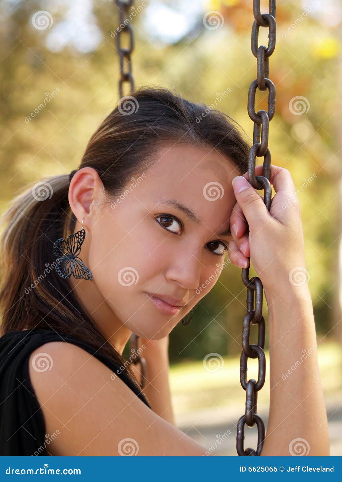Young Asian American Woman on Swing Chains Stock Photo - Image of young ...