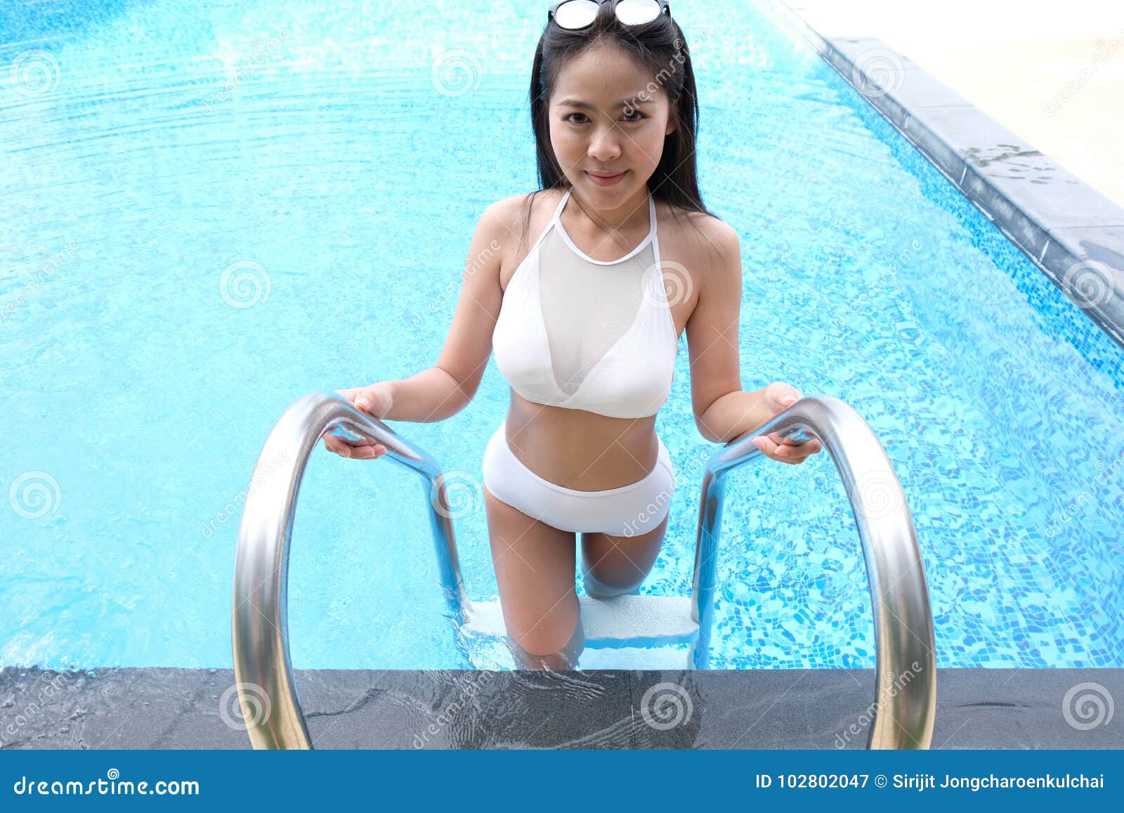 Young Asian Beautiful Woman Relaxing in Swimming Pool. Stock Image ... Young Asian Beautiful Woman Relaxing in Swimming Pool. Stock Image ...