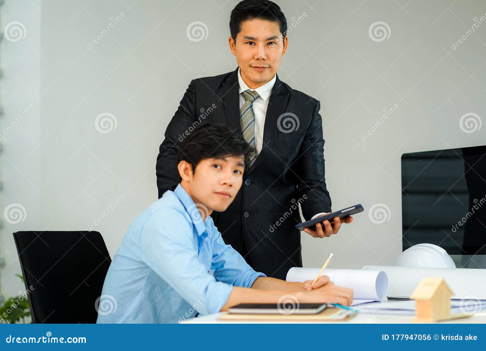 Young Asian Boss Talked To Engineer with the Building Construction Plan ...