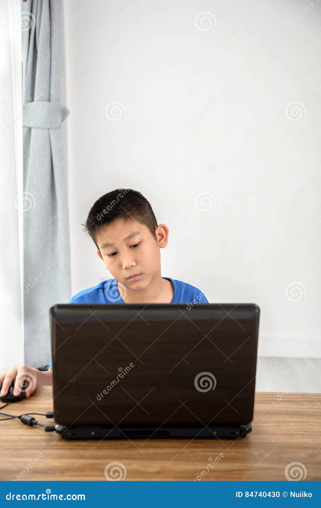 Young Asian Boy Using Laptop Technology at Home. Copyspace Stock Photo ...