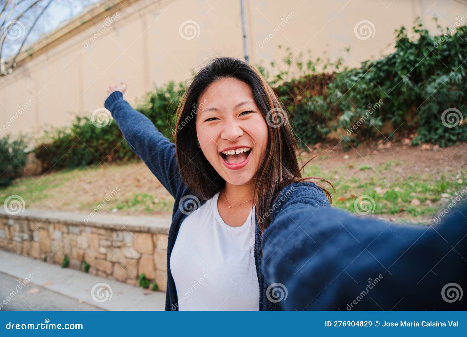 Young Asian Brunette Woman Taking A Selfie Portrait Smiling And