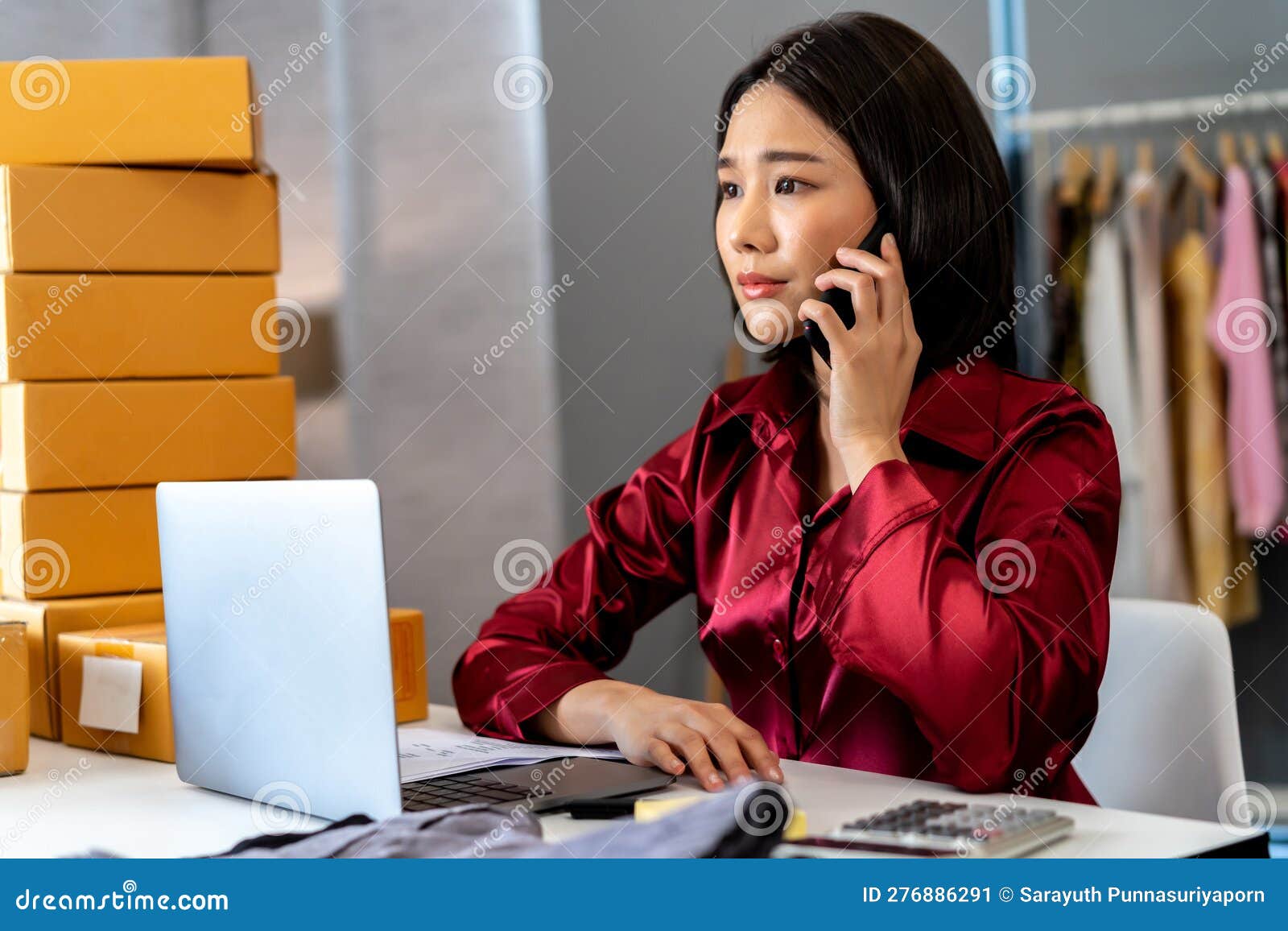 Young Asian Business Female Entrepreneur Having a Phone Call Problem ...
