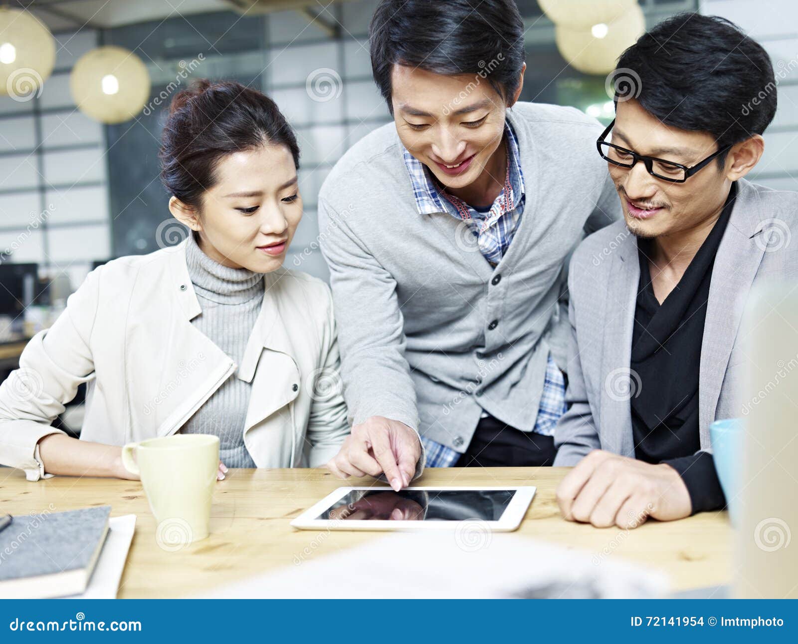 Young Asian Business Team Working in Office Stock Photo - Image of ... Young Asian Business Team Working in Office Stock Photo - Image of ...