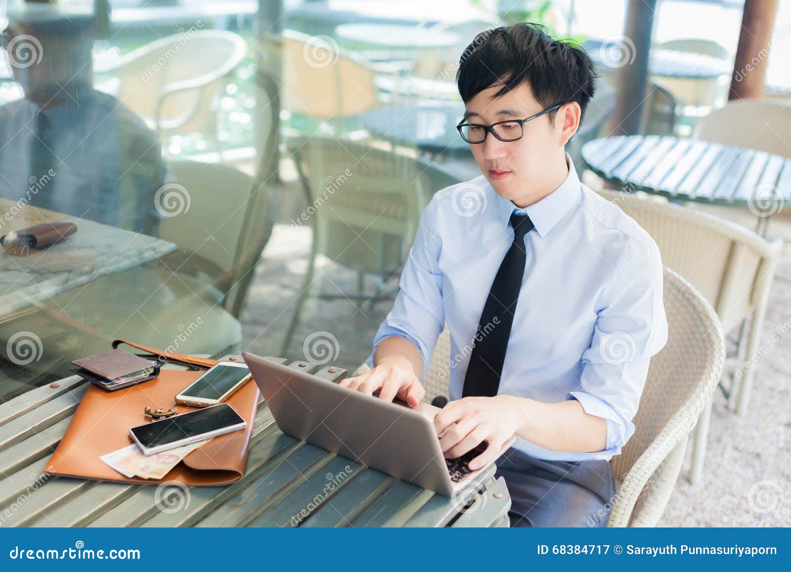 Young Asian Businessman Working on Computer while Standing in Ou Stock ...