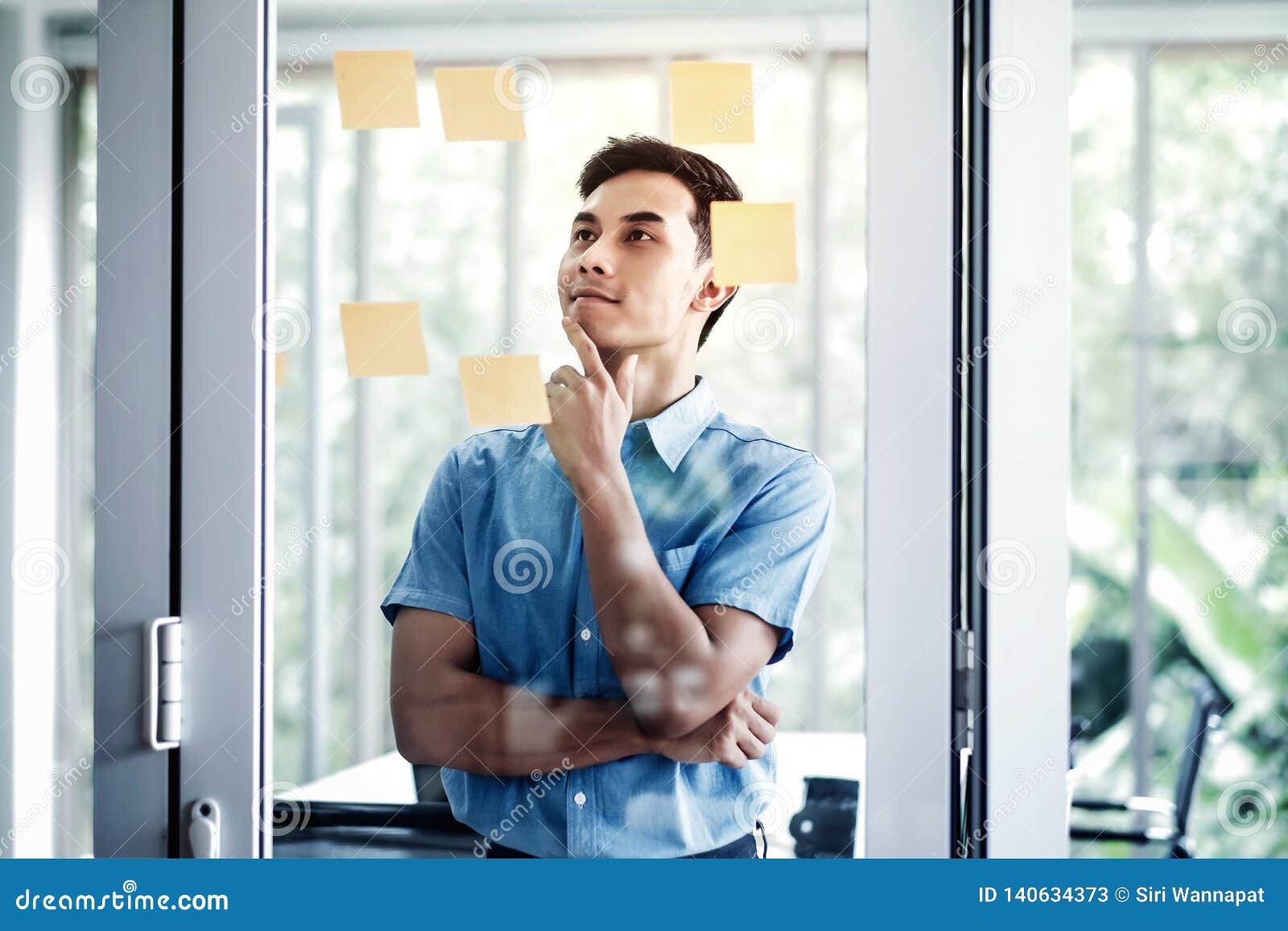 Young Asian Businessman Working in Office Meeting Room. Man Analyzing ... Young Asian Businessman Working in Office Meeting Room. Man Analyzing ...