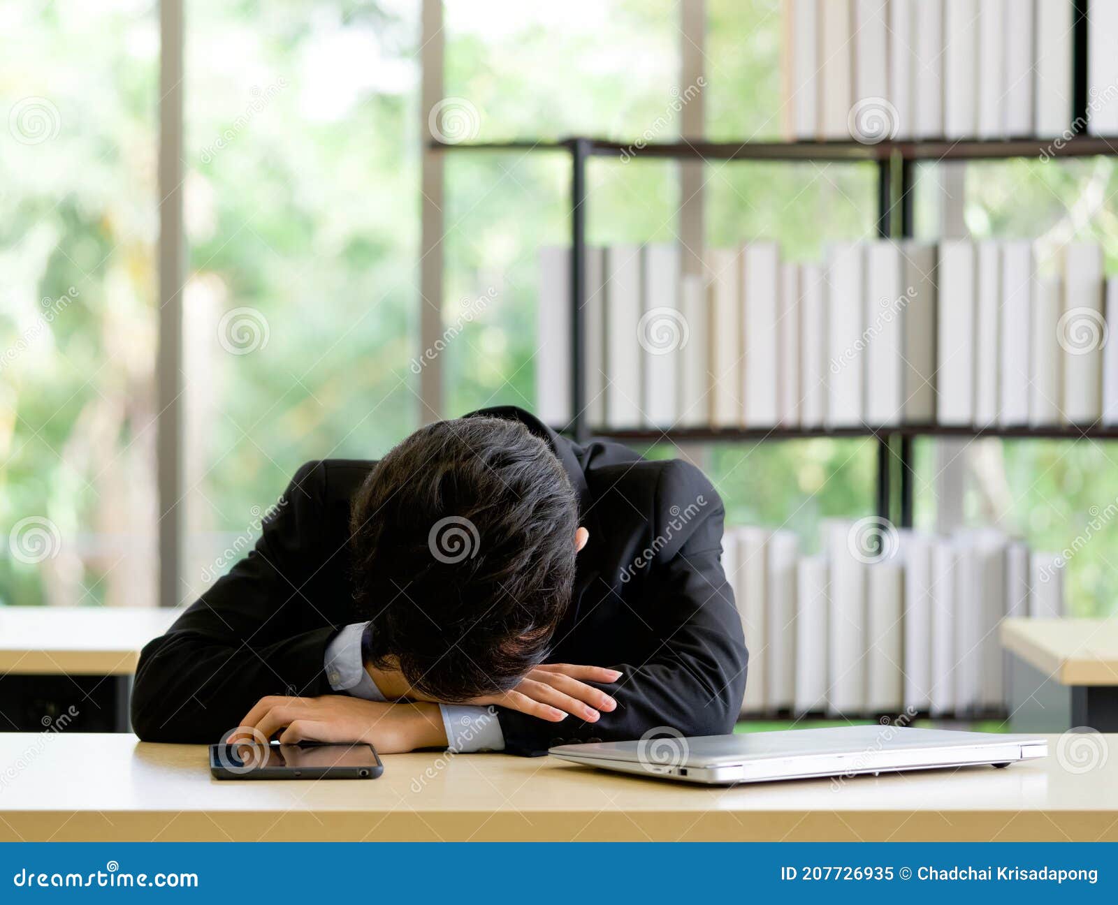 Young Asian Employee Take a Nap in the Office on a Table with Tablet ...