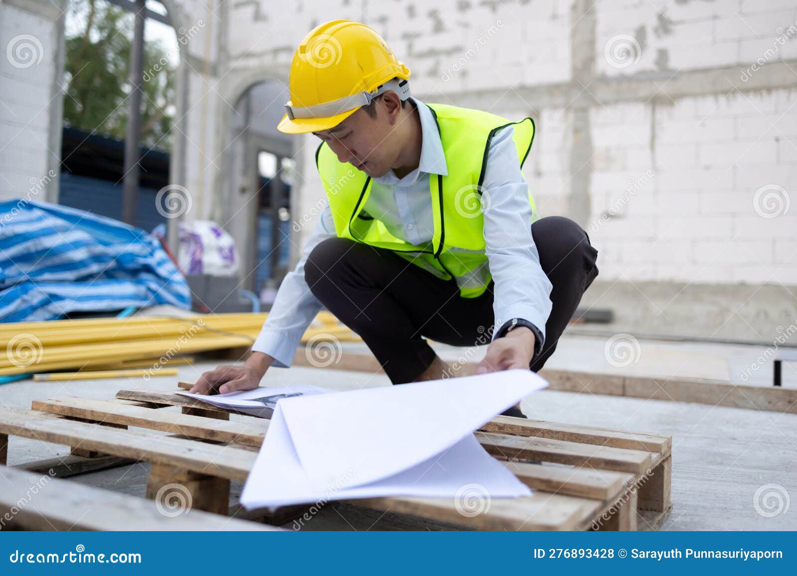 Young Asian Engineer in Engineering Uniform and Helmet at Construction ...