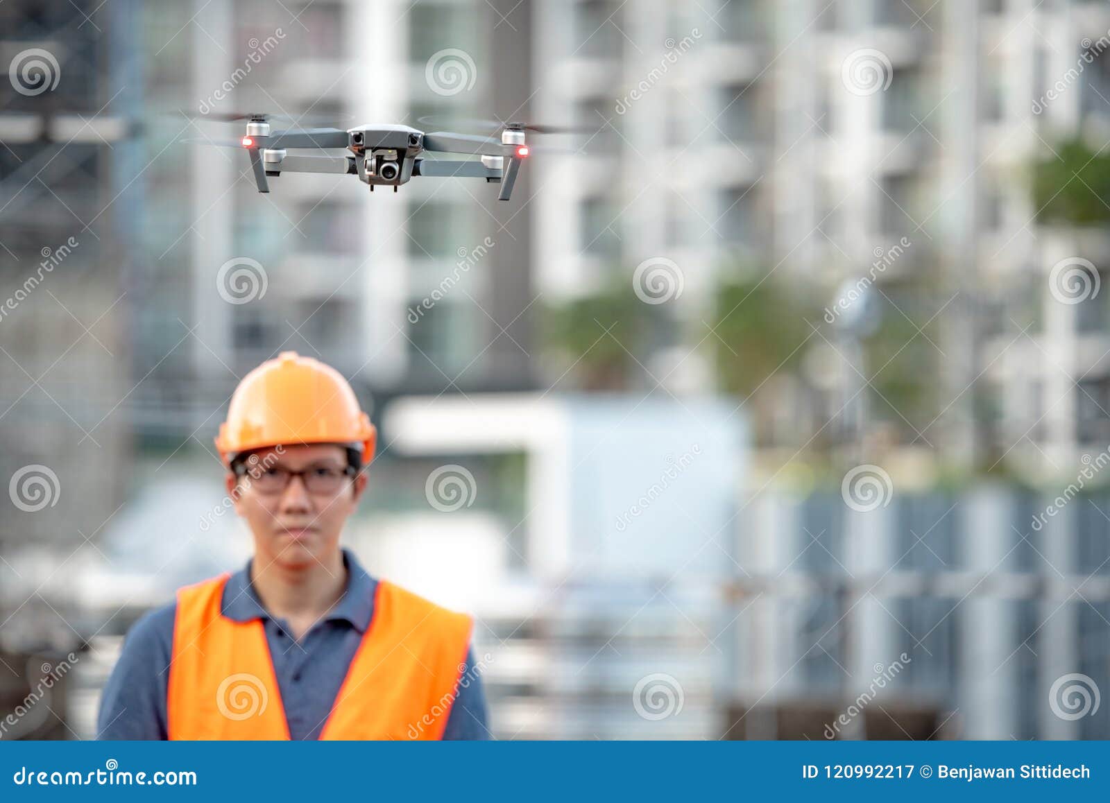 Young Asian Engineer Flying Drone Over Construction Site Stock Image ...