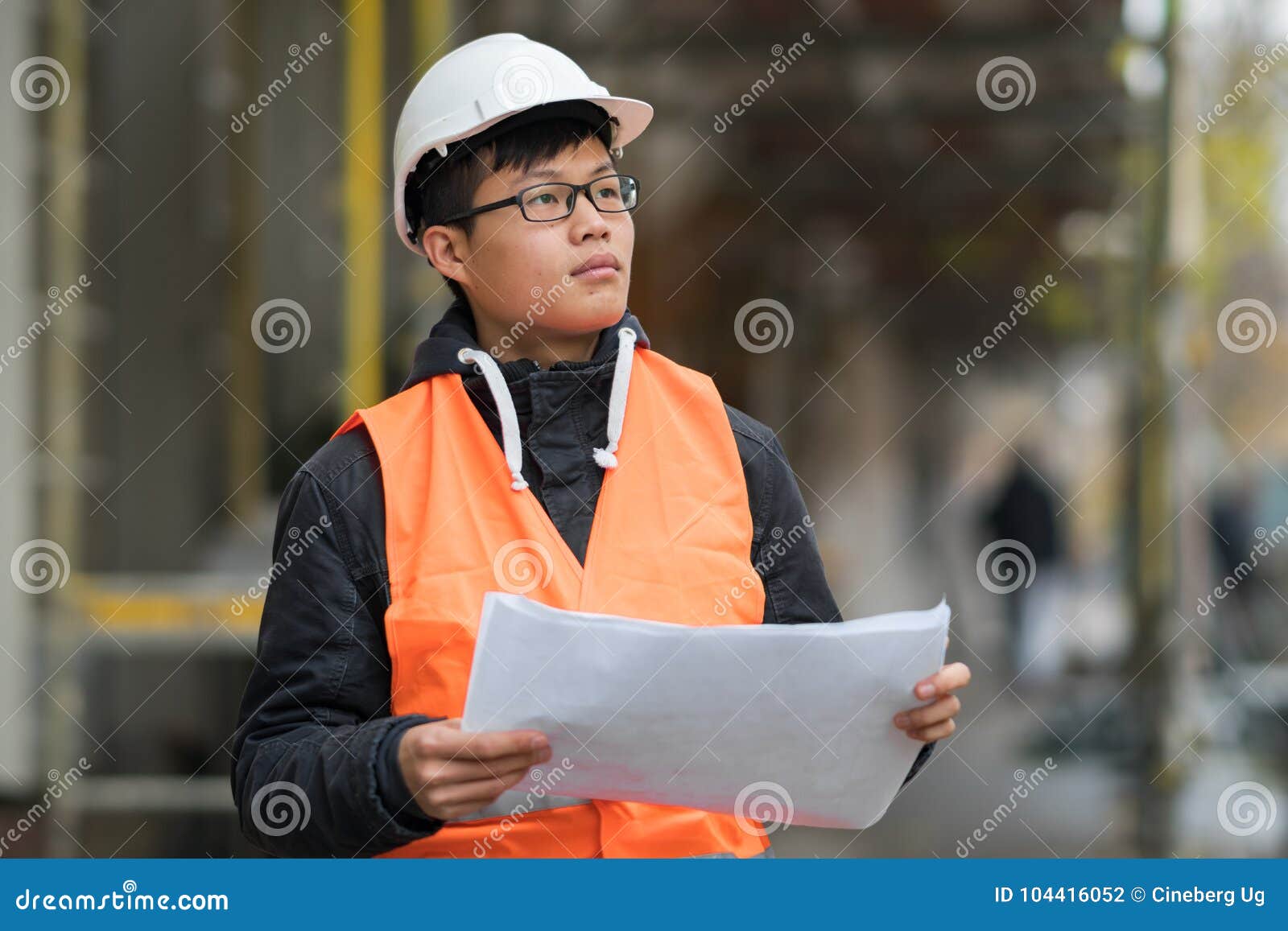 Young Asian Engineer at Work on Construction Site Stock Photo - Image ...