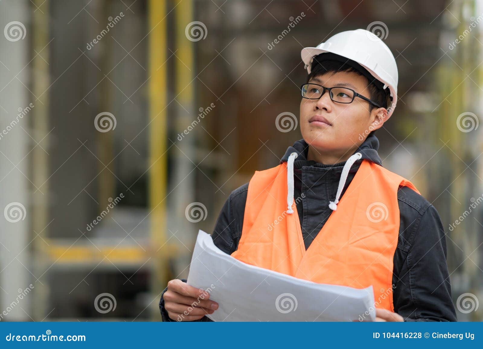 Young Asian Engineer at Work on Construction Site Stock Photo - Image ...