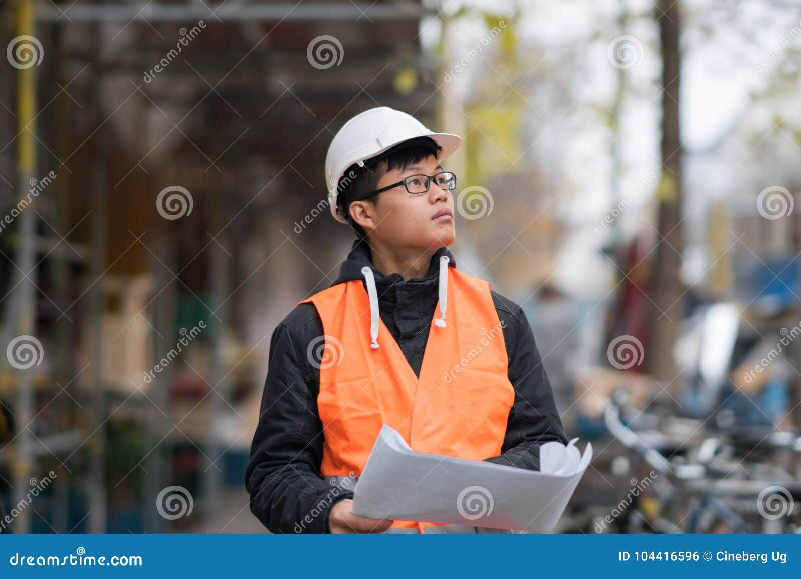 Young Asian Engineer at Work on Construction Site Stock Photo - Image ...