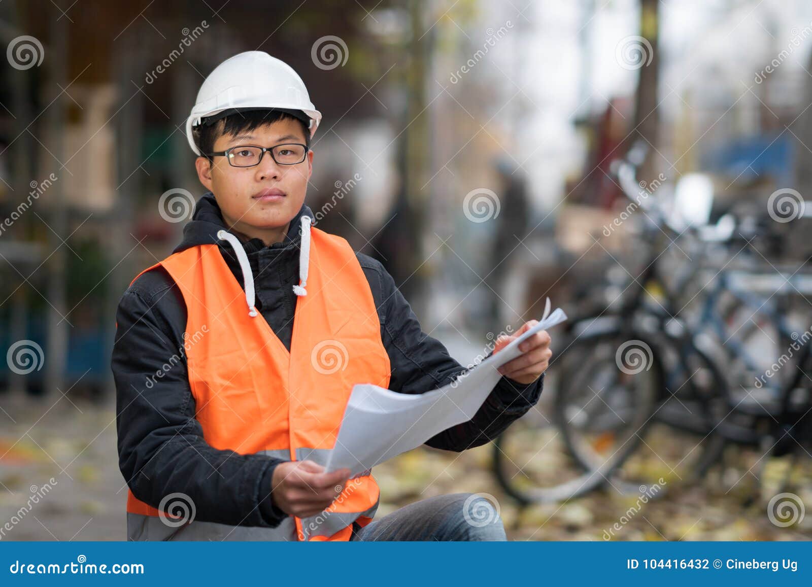 Young Asian Engineer at Work on Construction Site Stock Photo - Image ...