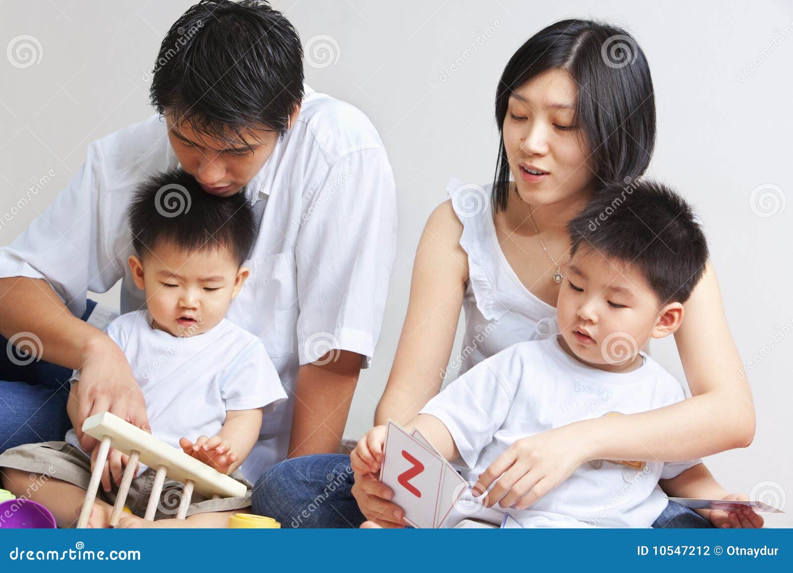 Young Asian Family Spending Time Together Stock Photo - Image of tutor ...