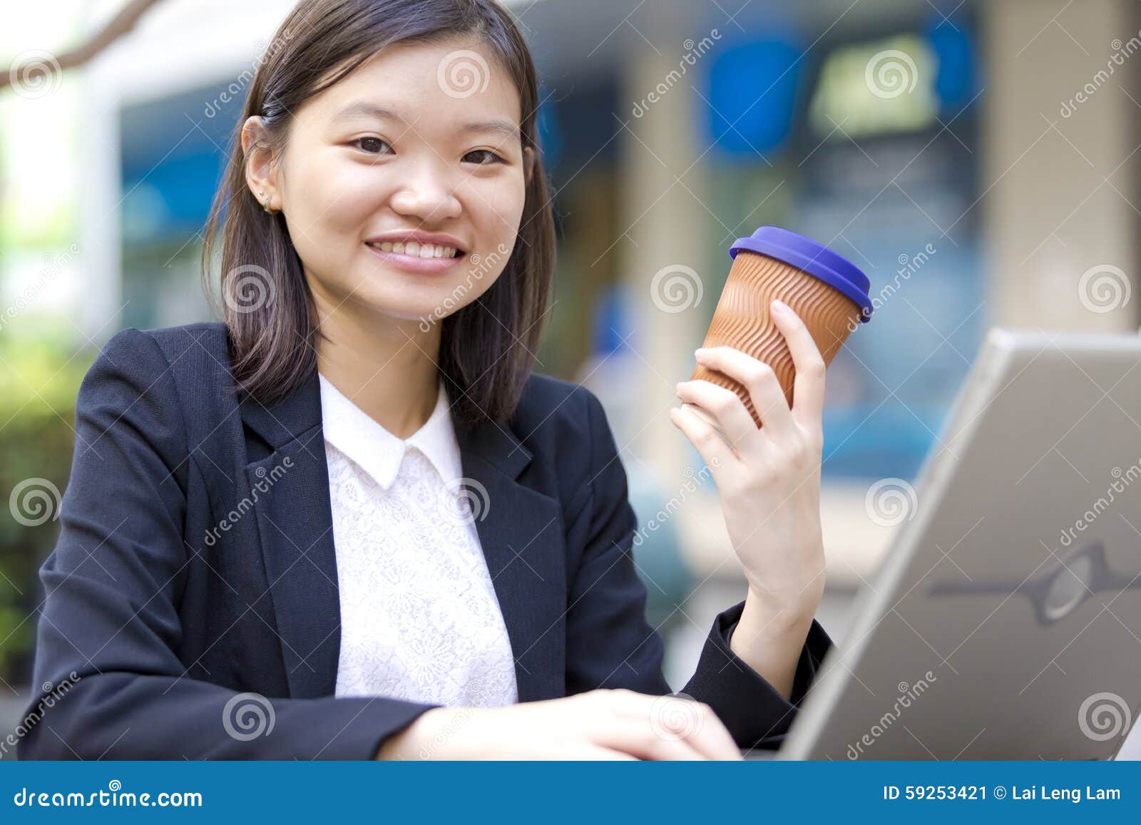 Young Asian Female Executive Drinking Coffee and Using Laptop PC Stock ...