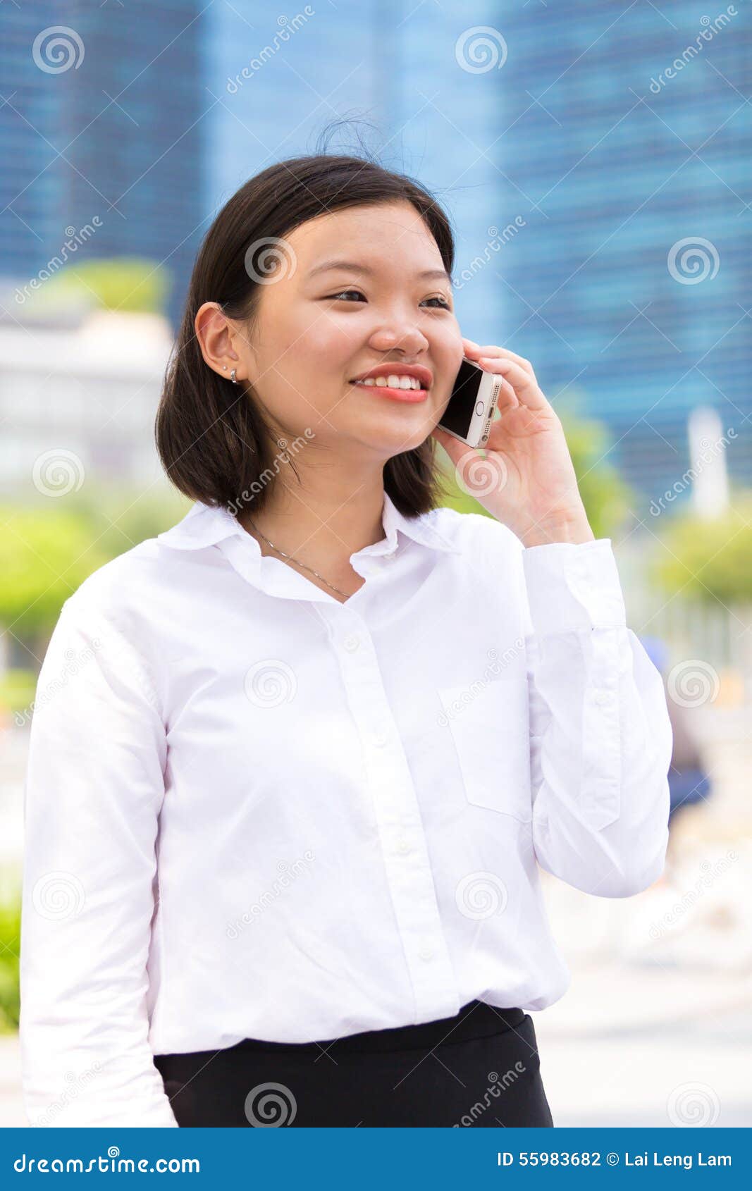 Young Asian Female Executive Using Smart Phone and Smiling Stock Photo ...