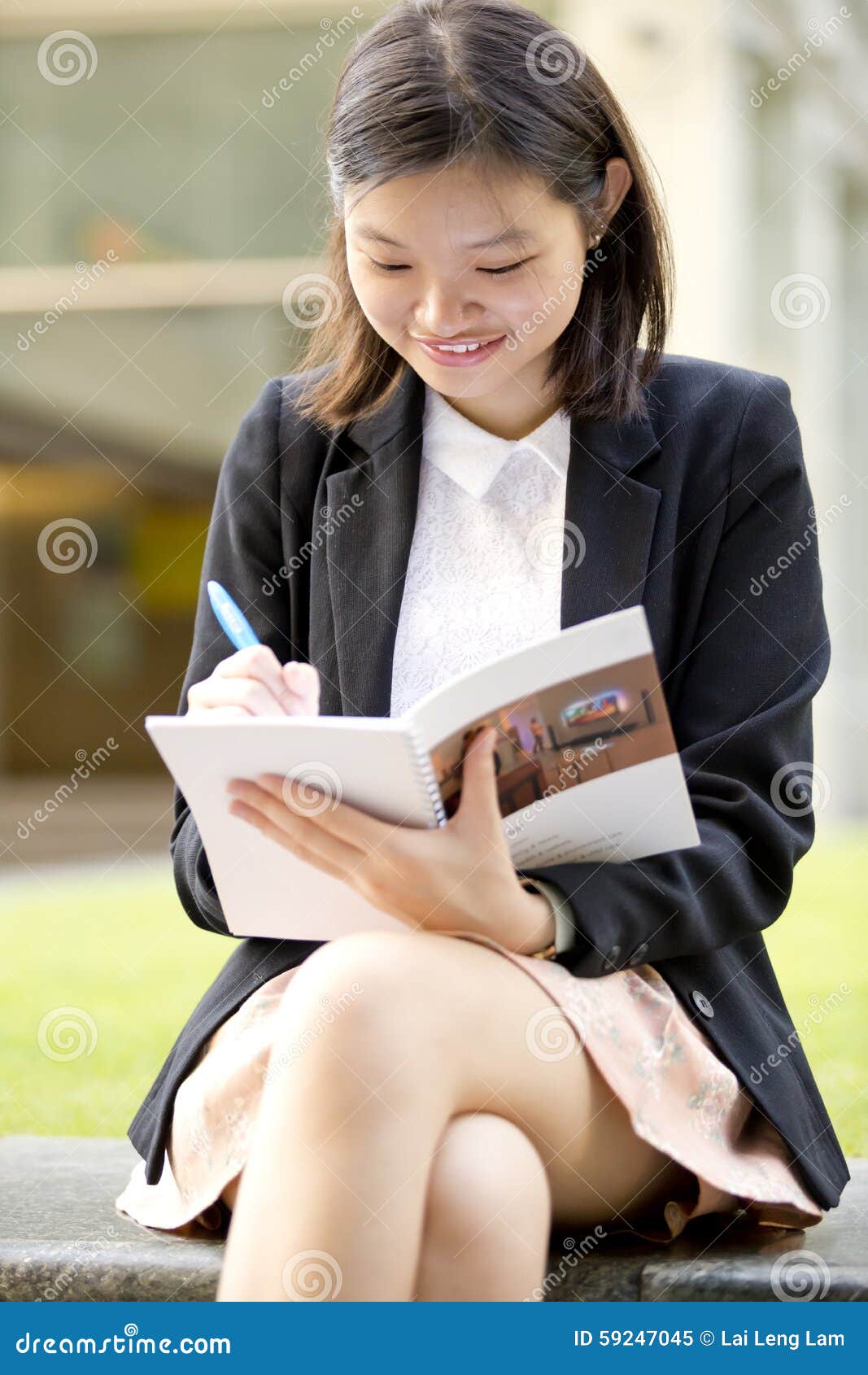 Young Asian Female Executive Writing on Notepad Stock Image - Image of ...