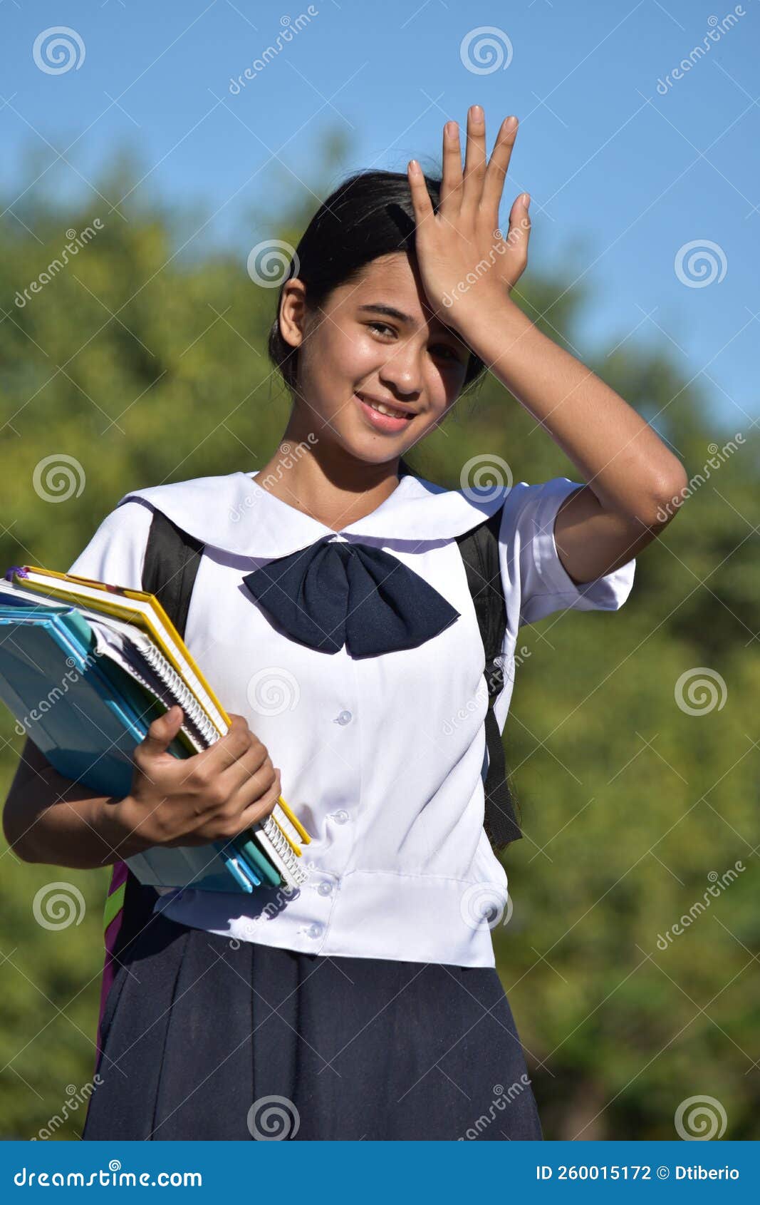Young Asian Female Student Memory Problems Wearing Uniform Holding ...