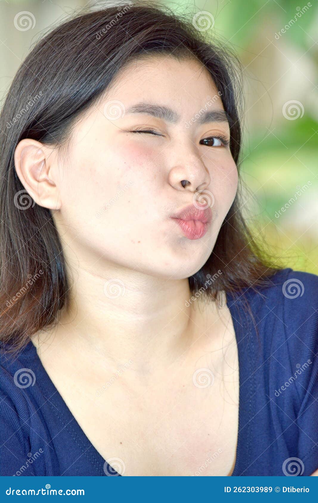A Young Asian Female Winking Stock Image - Image of blink, wink: 262303989