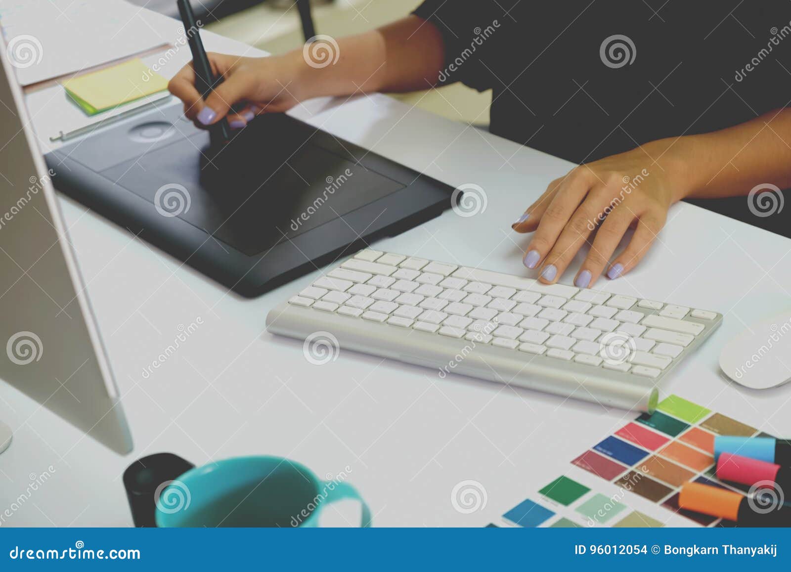 Designer Working with Digital Tablet and Laptop Computer at Desk Stock ...