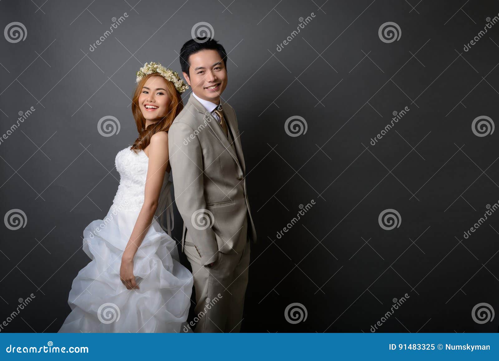 Young Asian Groom and Bride Posing and Smiling in Studio for Pre ...