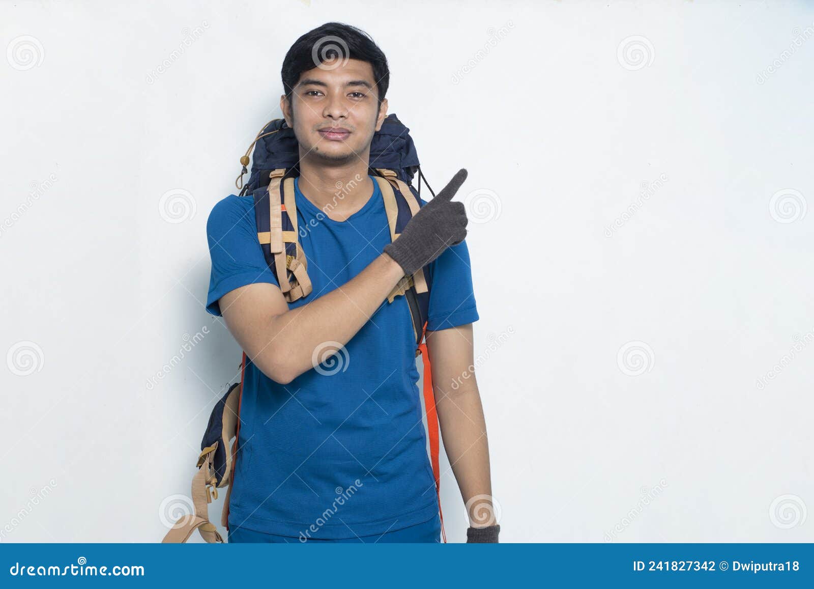Young Asian Hiker Man with Backpack Pointing Finger on Empty Space on ...