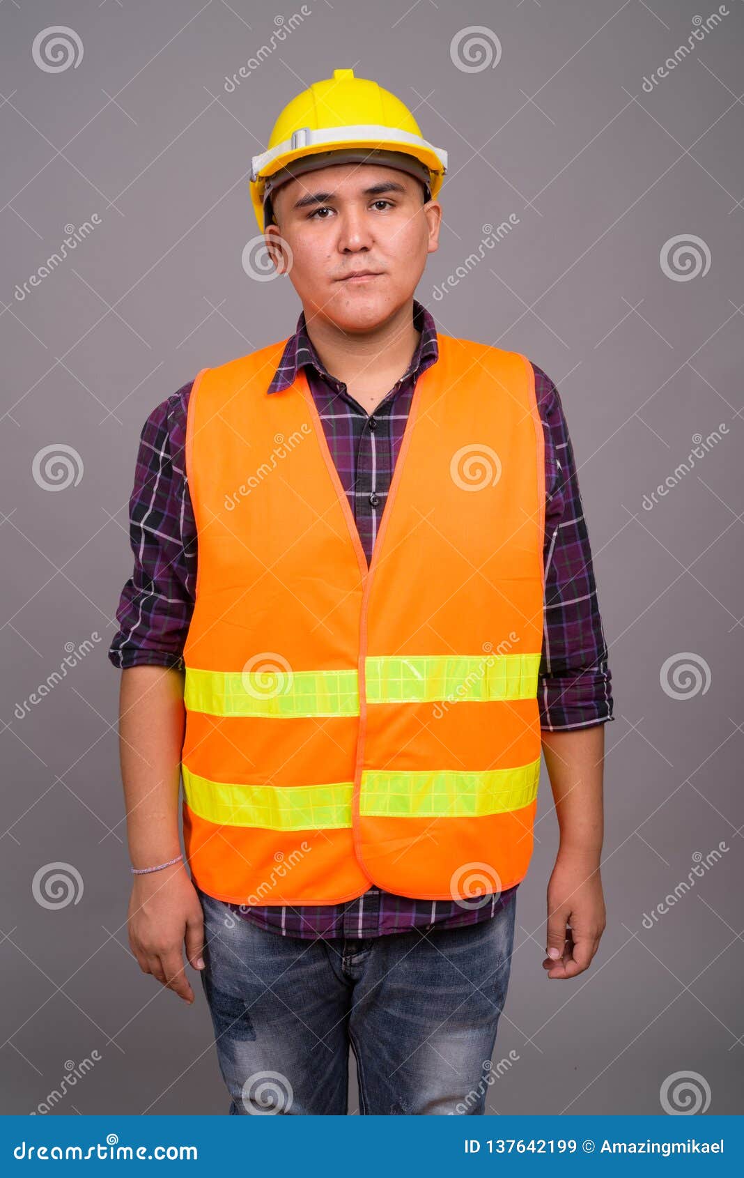 Young Asian Man Construction Worker Against Gray Background Stock Image ...