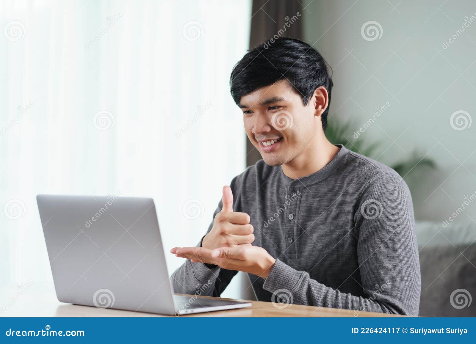 Young Asian Man Deaf Disabled Using Laptop Computer for Online Video ...