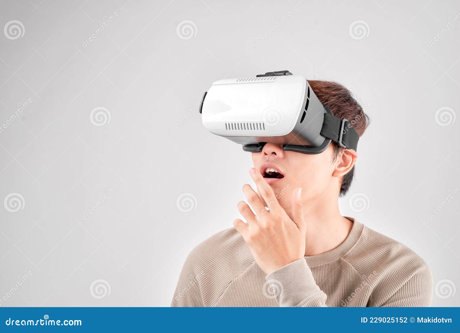 Young Asian Man Gestures with His Hands As he Uses a Vr Headset Stock ...