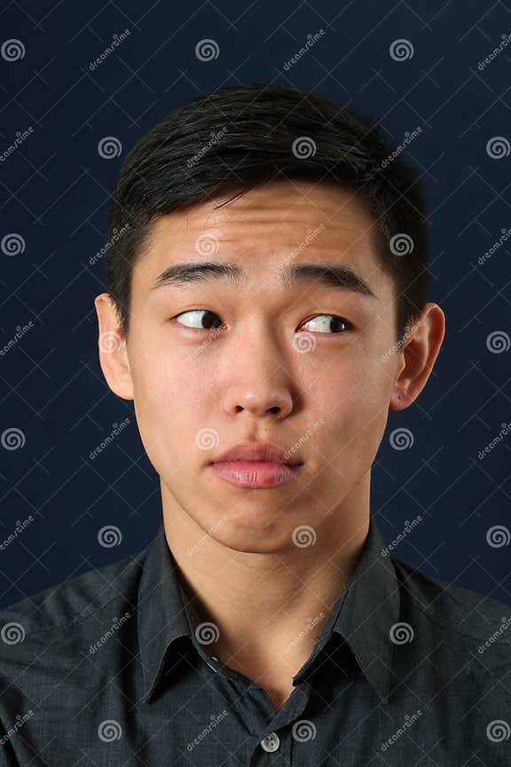 Young Asian Man Looking Sideways Stock Image - Image of asian, serious ...
