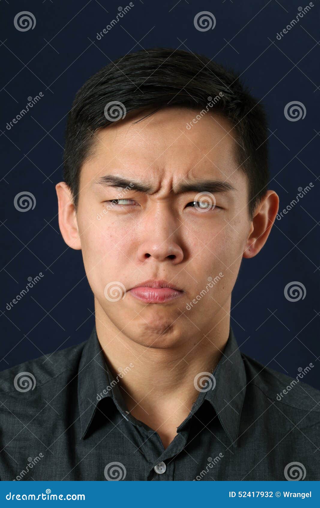 Young Asian Man Making Face and Looking Sideways Stock Photo - Image of ...