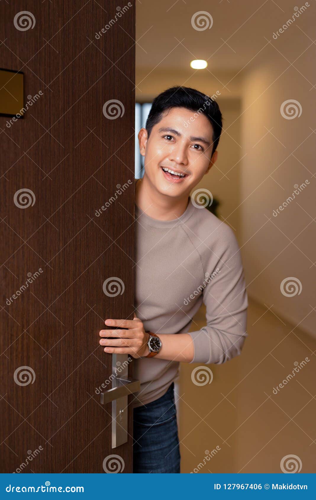 Young Asian Man Open His Front House Door and Smiling Stock Photo ...