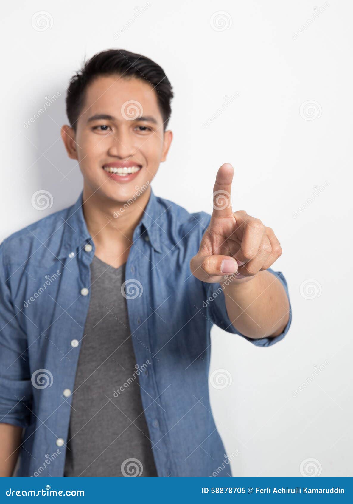 Young Asian Man Pressing Invincible Button, Stock Image - Image of ...