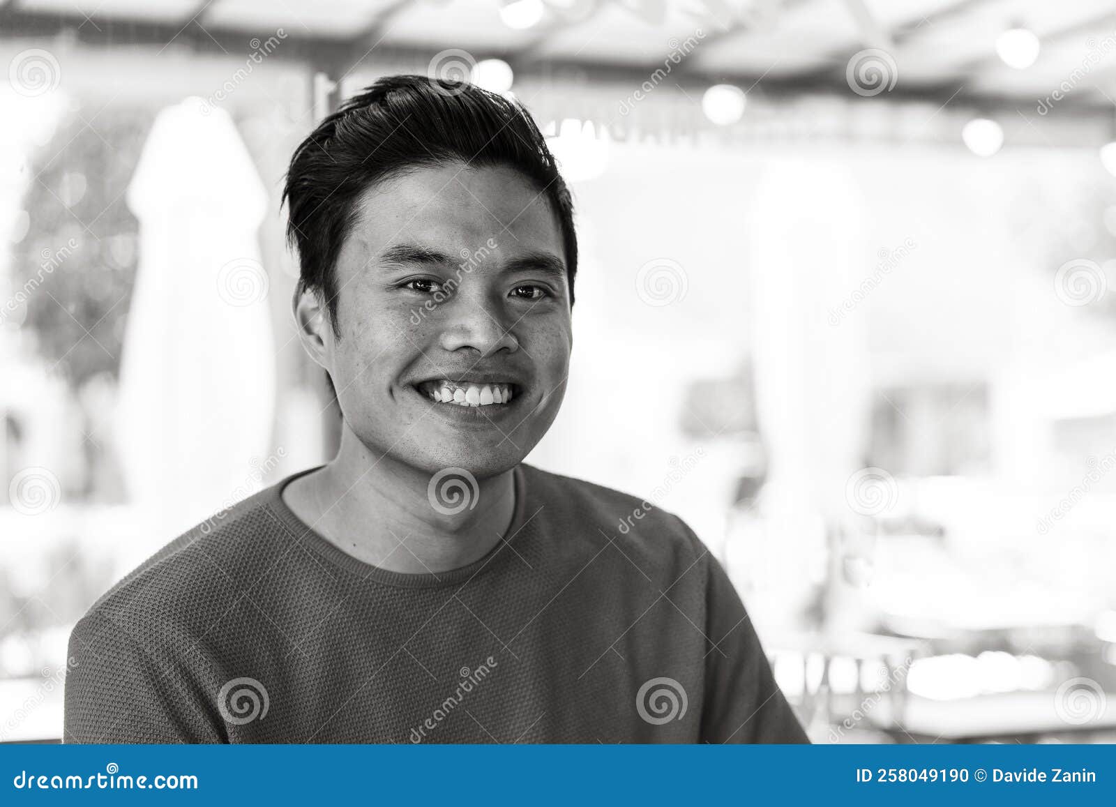 Young Asian Man Smiling on Camera Indoor - Vintage Filter with Focus on ...