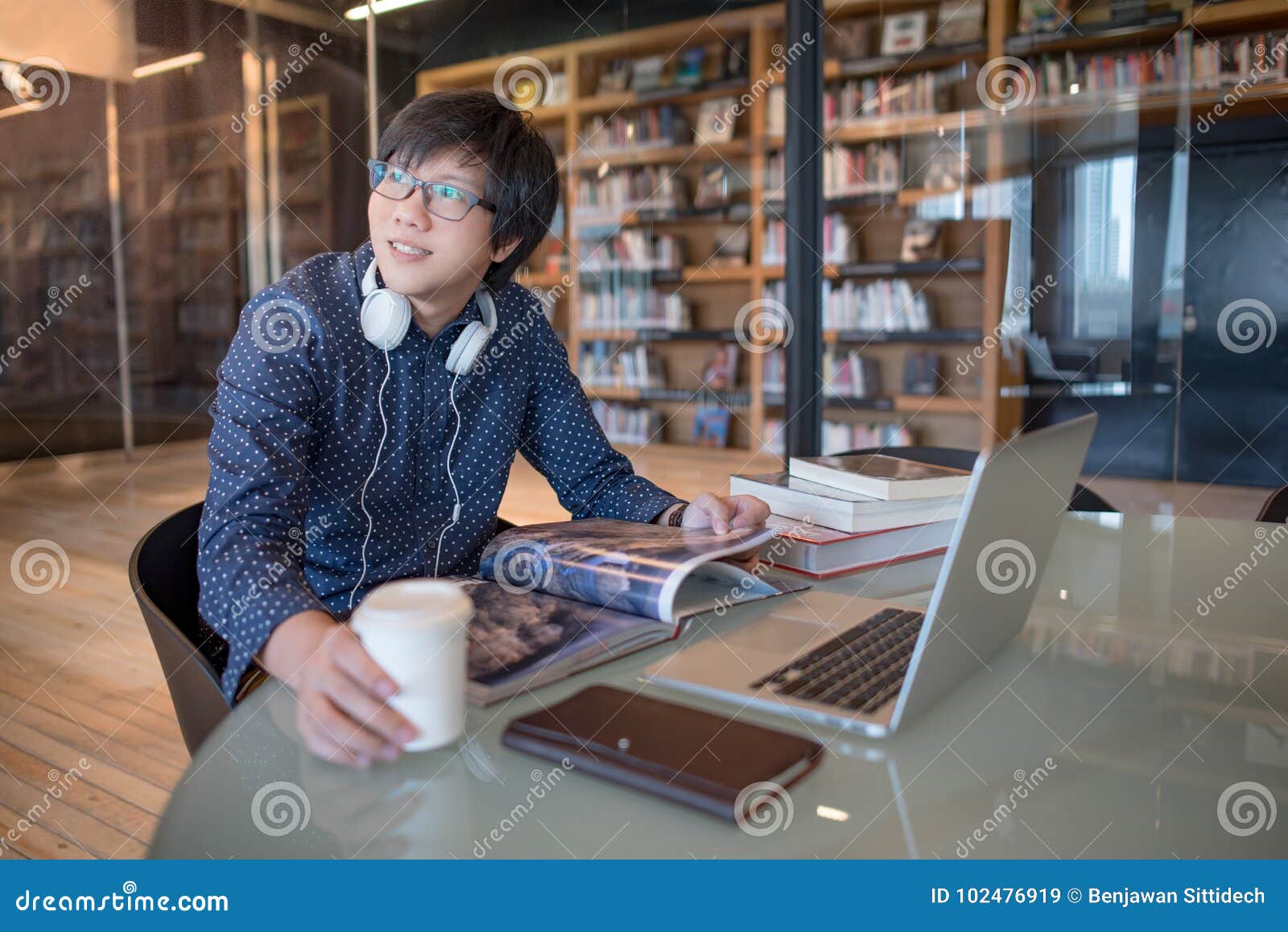 Young Asian Man University Student Reading Book in Library Stock Image ...