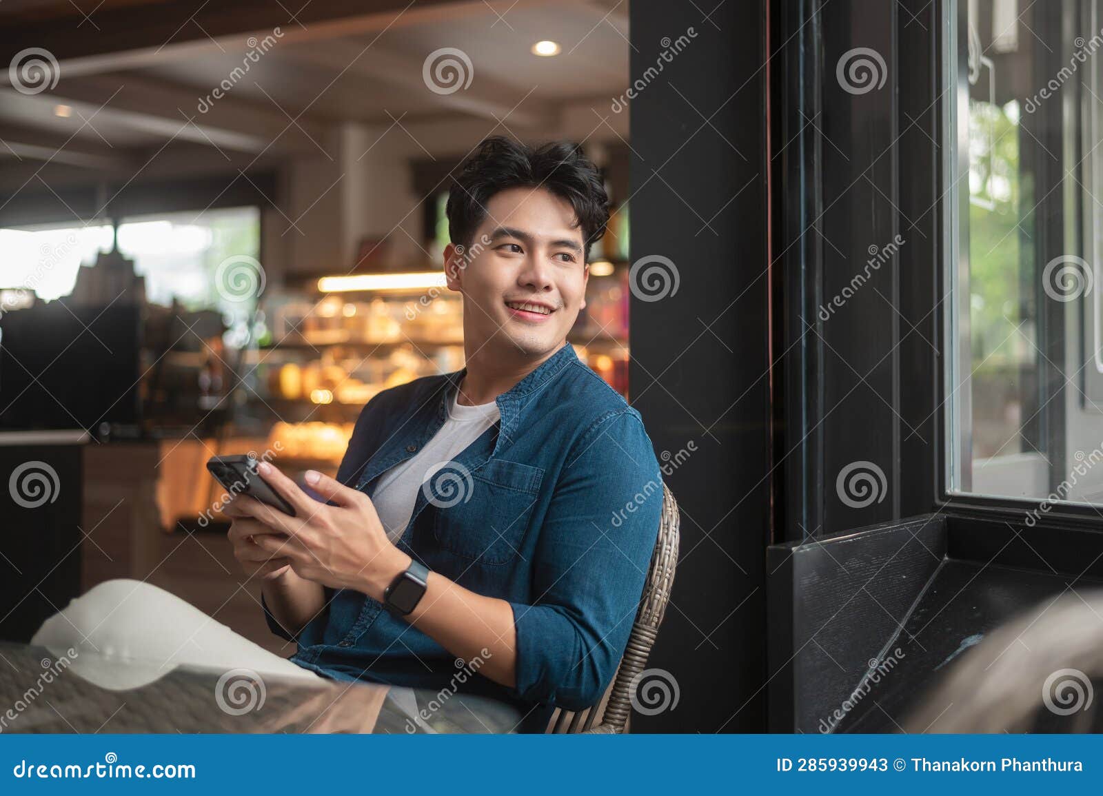 Young Asian Man Using Smart Phone in Cafe Stock Image - Image of cafe ...