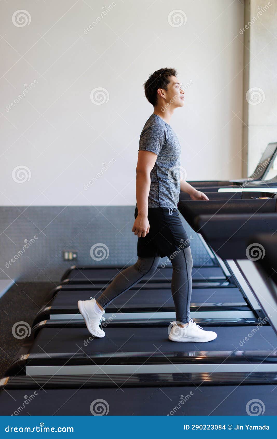 Walking on treadmill stock photo. Image of attire, handsome - 290223084