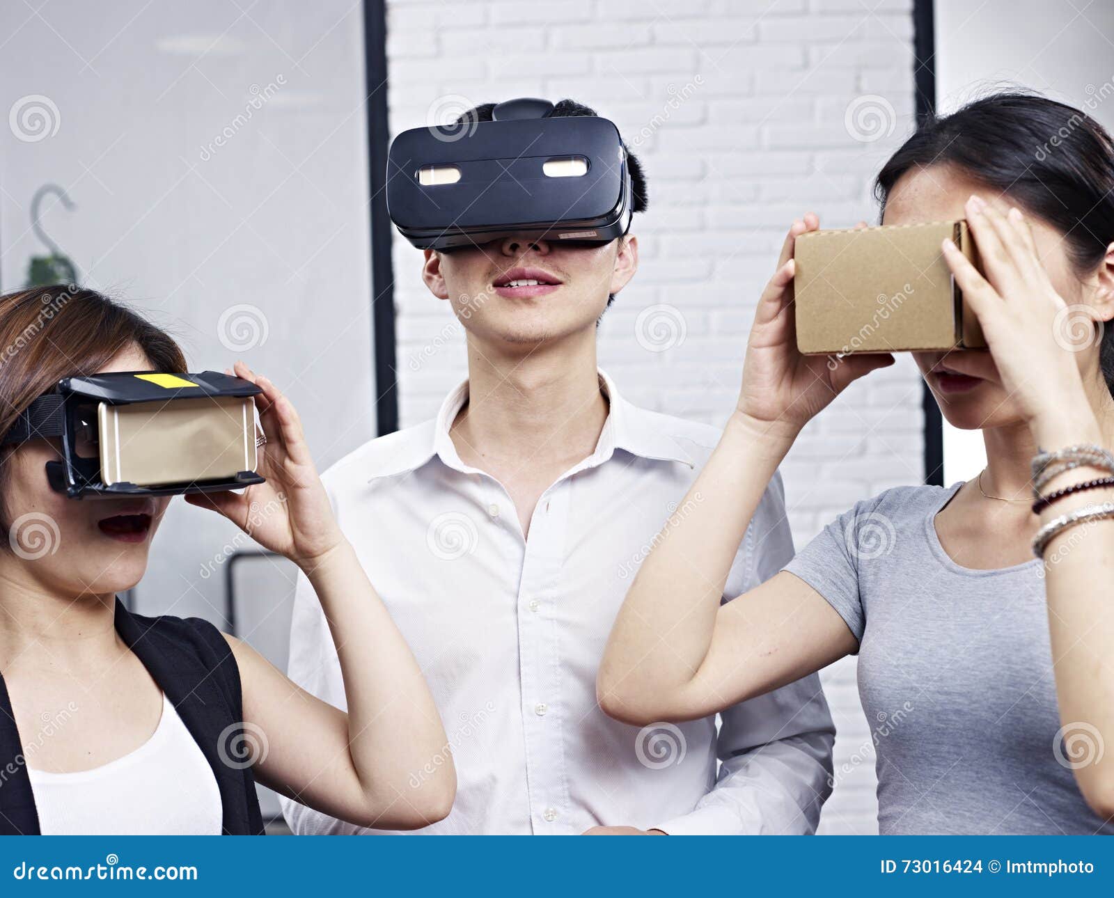 Young Asian People Trying Virtual Reality Goggles Stock Photo - Image ...