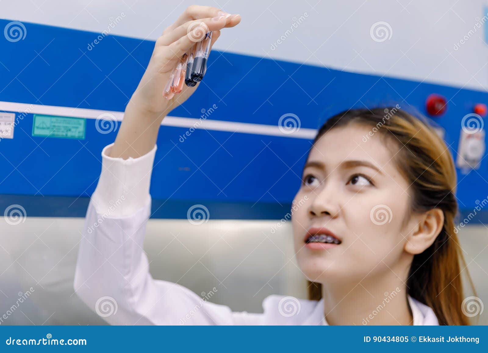 Young Asian Researcher Looking at the Flask in the Science Labor Stock ...